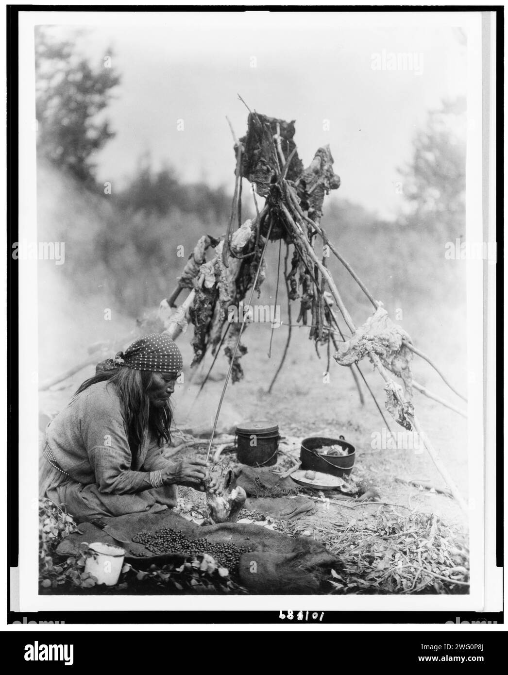 Woman cooking over fire Cut Out Stock Images & Pictures - Alamy