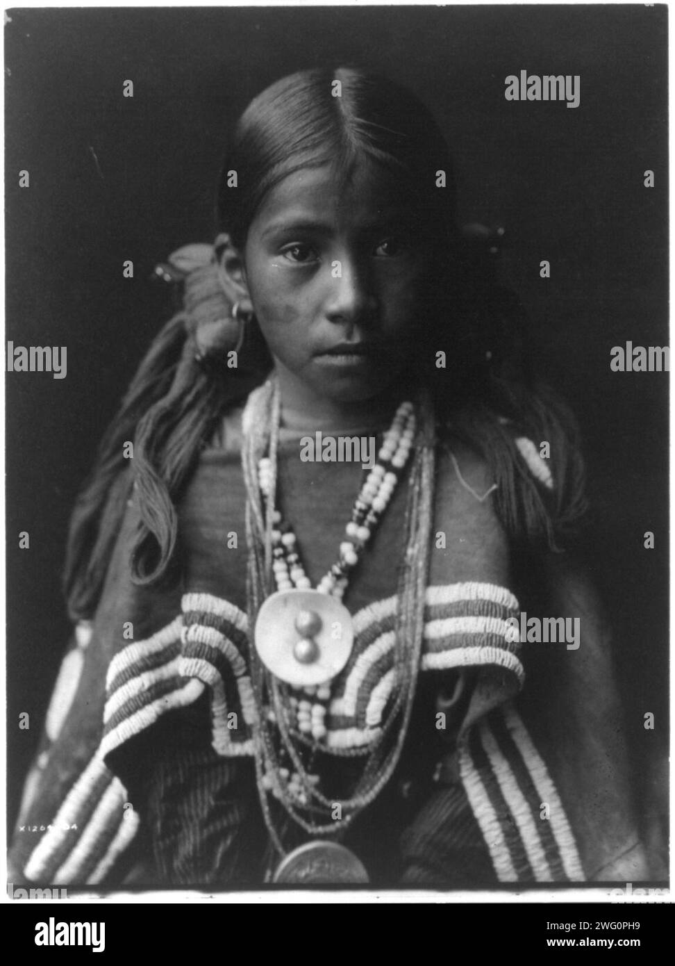 Jicarilla girl in feast dress, c1905. Jicarilla Apache girl, half ...