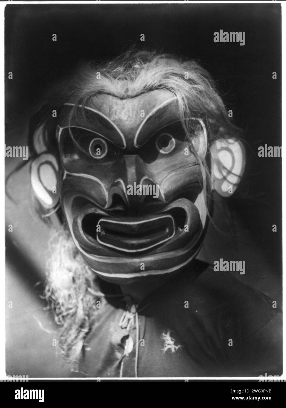 Pgwis-Qagyuhl, c1914. Kwakiutl person wearing mask of mythical creature ...