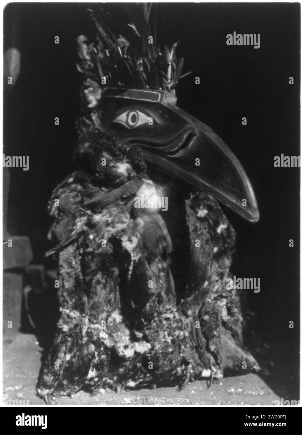 Kwahwumhl-Koskimo, c1914. Dancer wearing raven mask with coat of ...