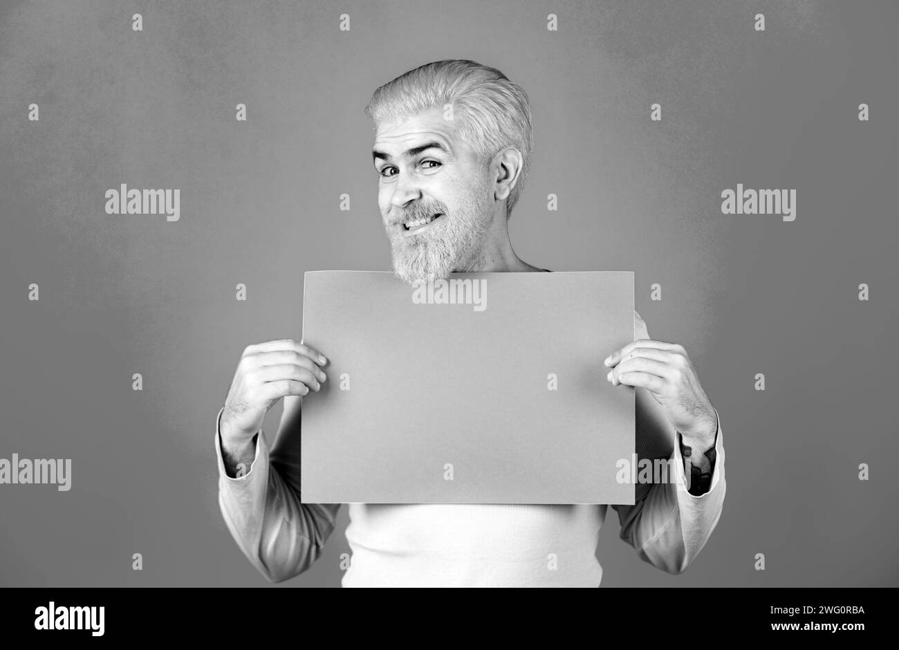 Handsome man holding colorful Black and White Stock Photos & Images - Alamy