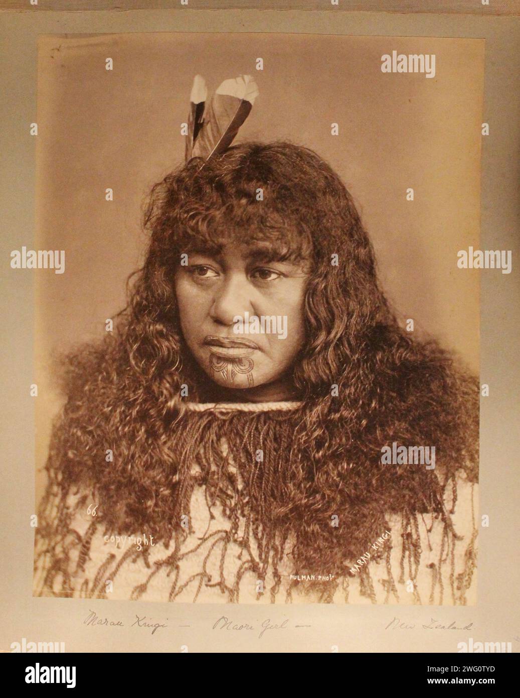 A Maori girl, Marau Kingi, poses against a plain background. She has ...