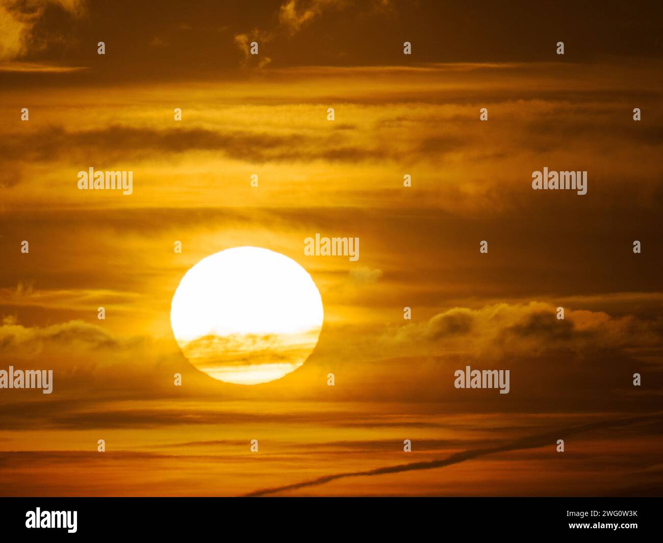 The sun rising at sunrise over the Nene Washes, Cambridgeshire, UK ...