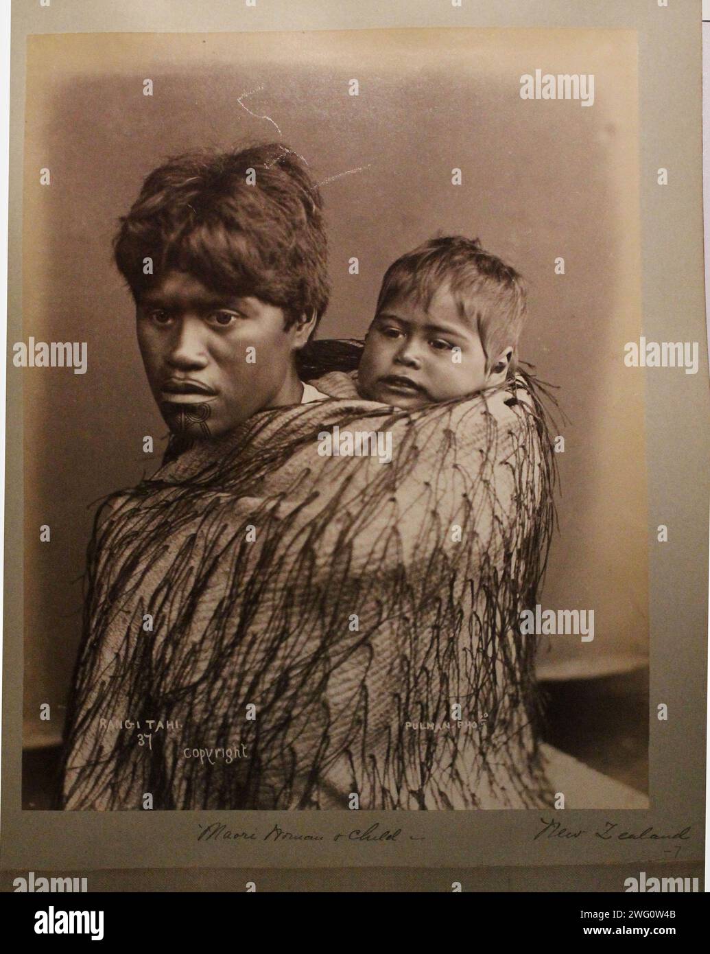 A Maori woman, Rangi Tahi, and child pose against a plain background ...