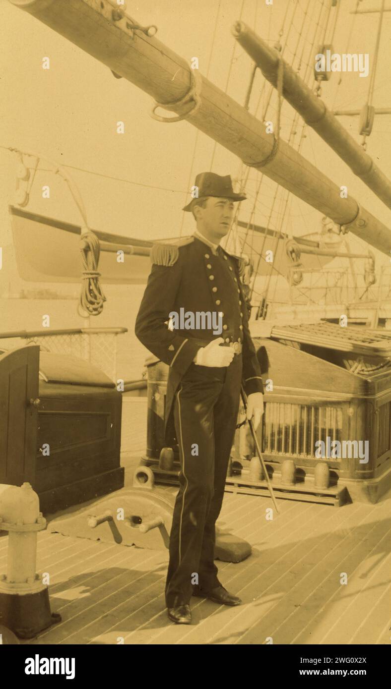 Unidentified naval officer, full-length portrait, standing aboard ship ...