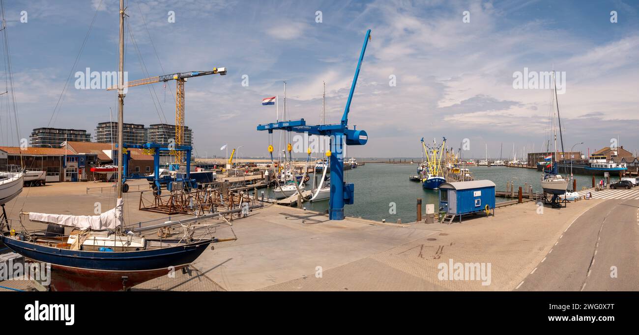 Panorama of harbour area with crane, fishing boats and sailboats ...