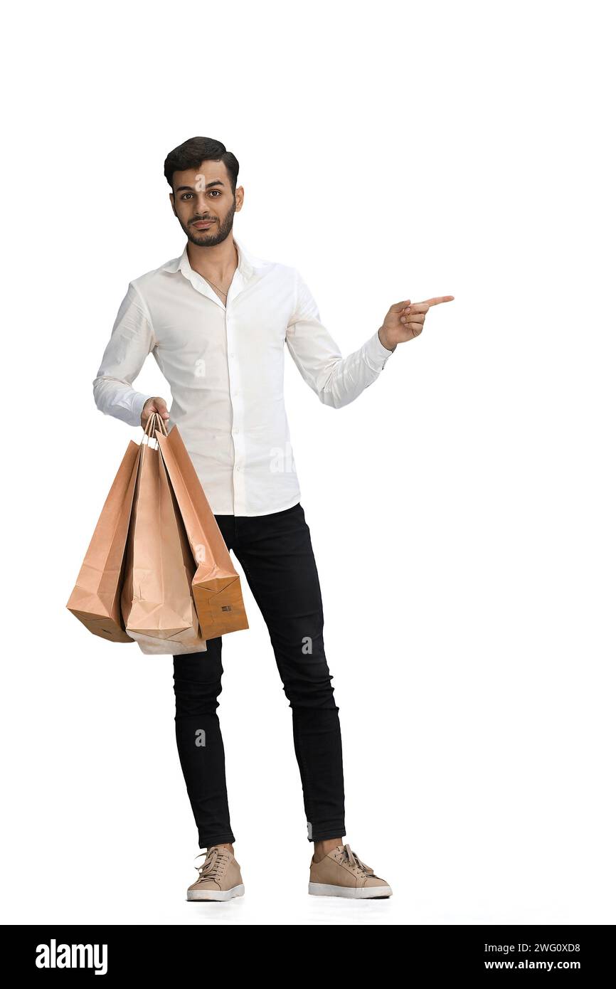 Man on a white background with shoppers point side Stock Photo - Alamy