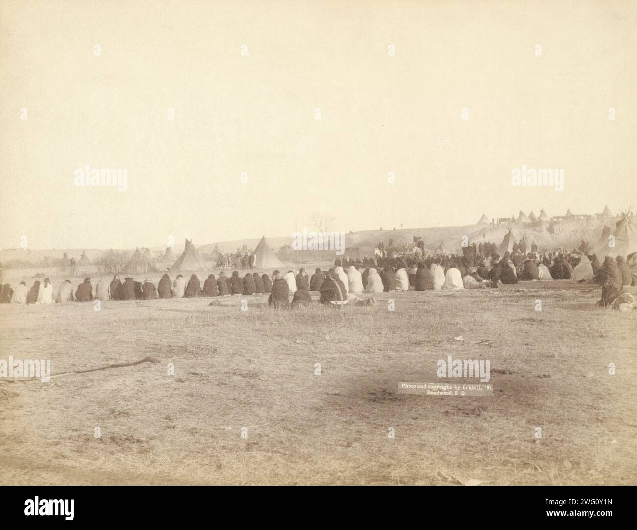 Indian Council in Hostile Camp, 1891. Rear view of a large semi-circle ...