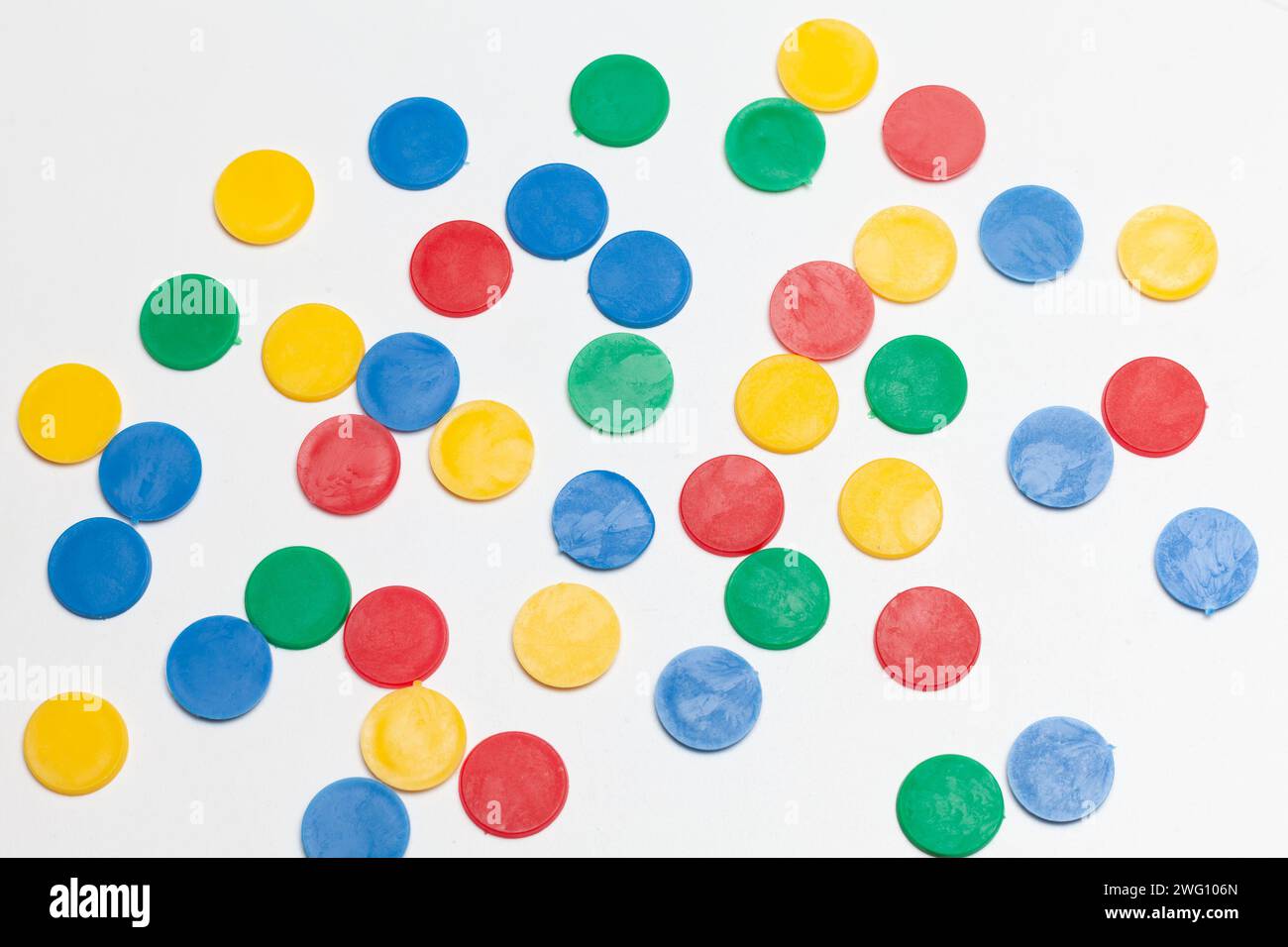 colorful round plastic tokens isolated on white background Stock Photo ...