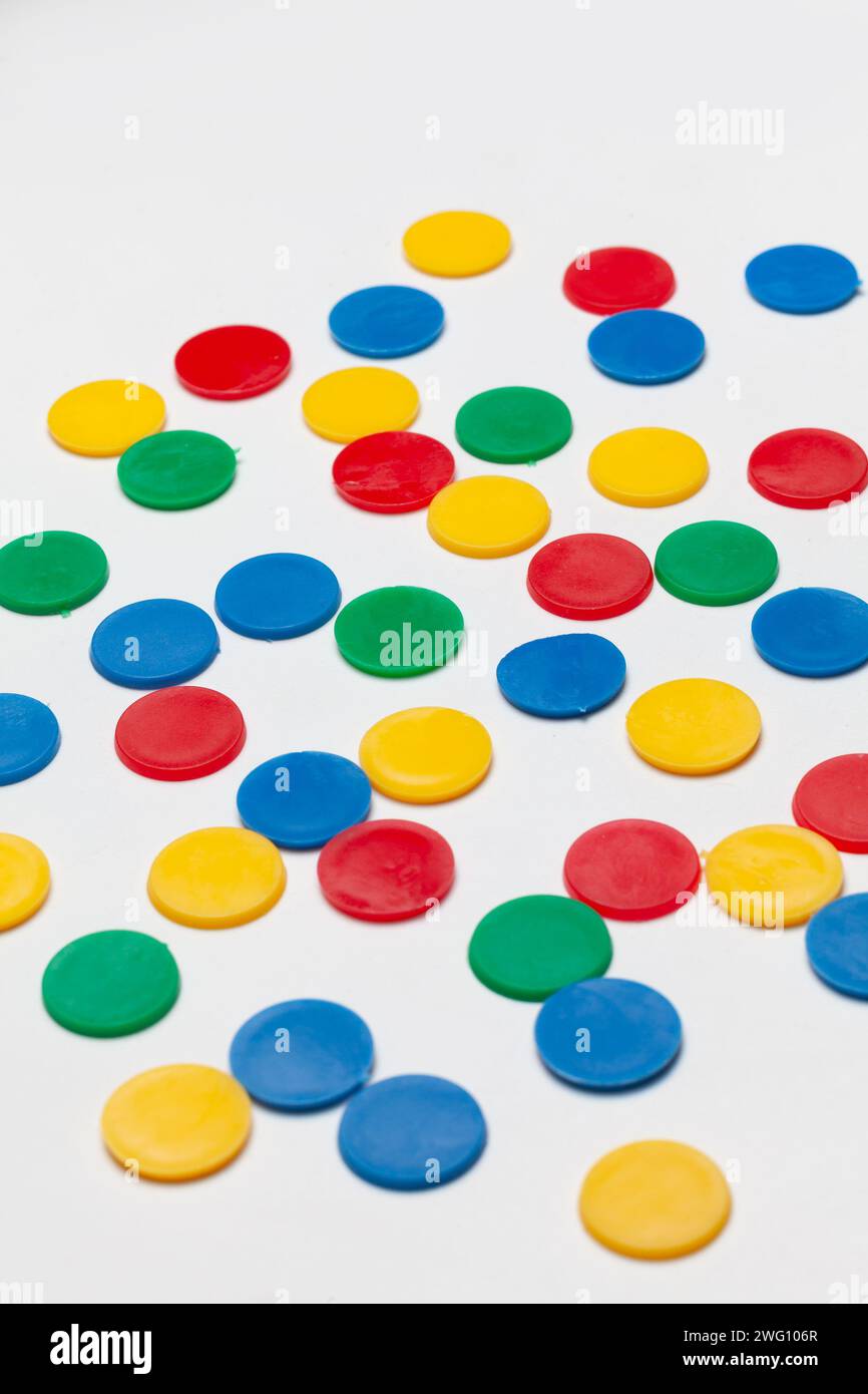 colorful plastic tokens isolated on white background Stock Photo - Alamy