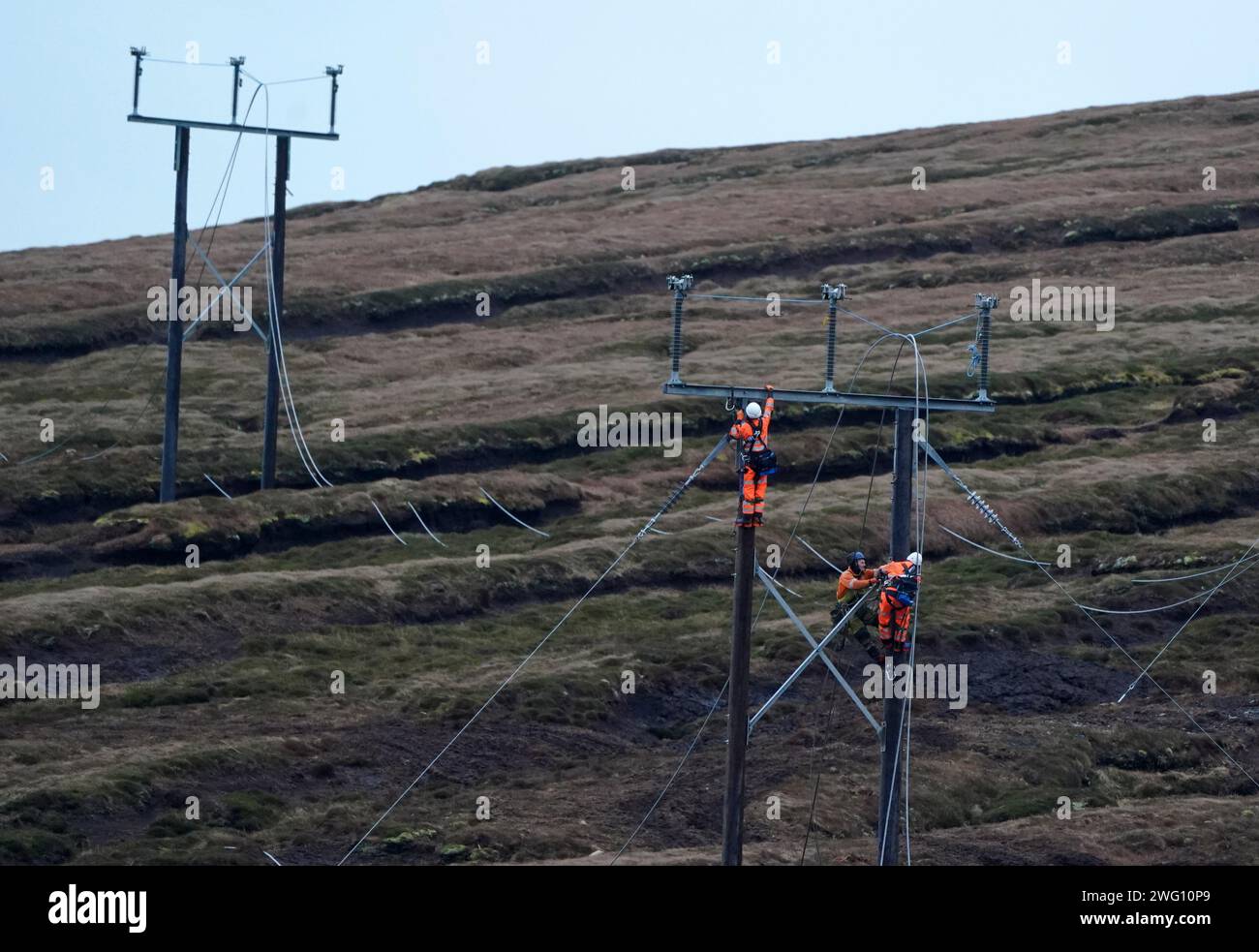 Workmen install power cables on Shetland. Picture date: Thursday ...