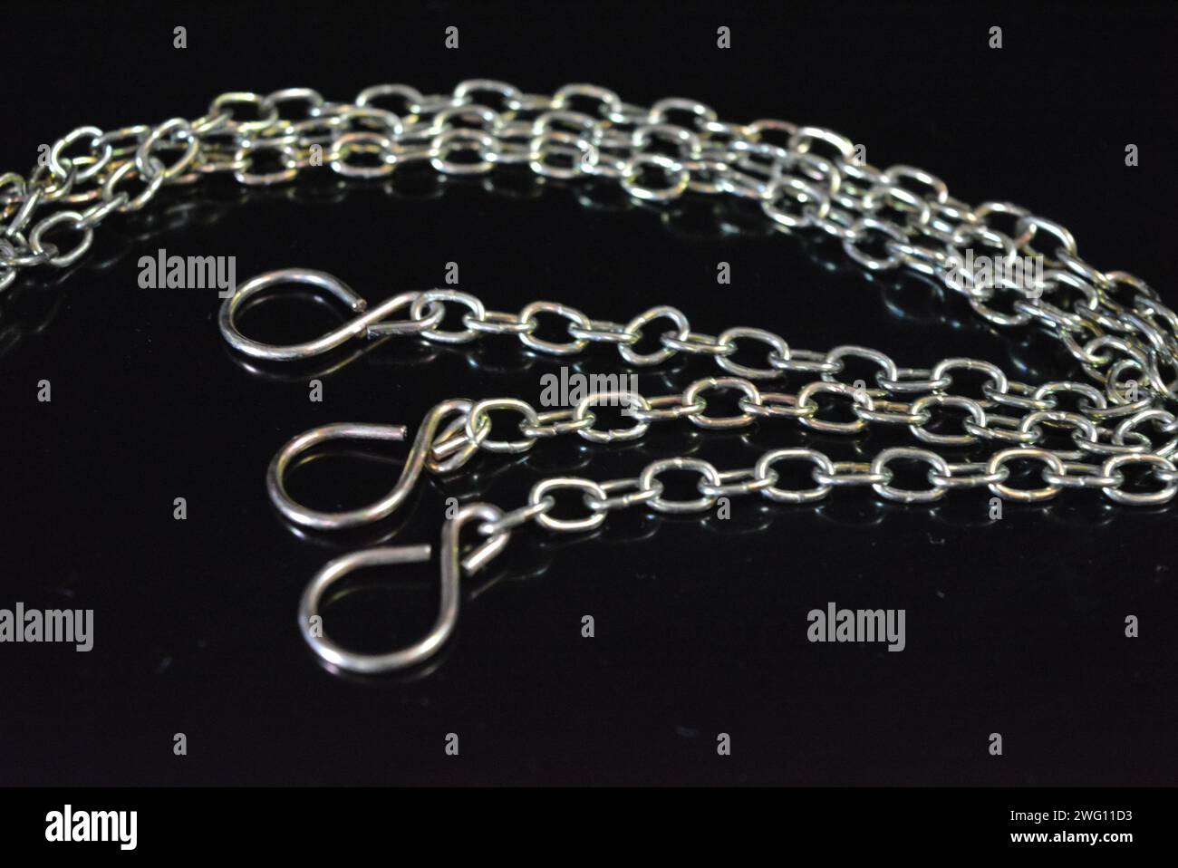Home furnishings, metal chains of different types and styles arranged ...