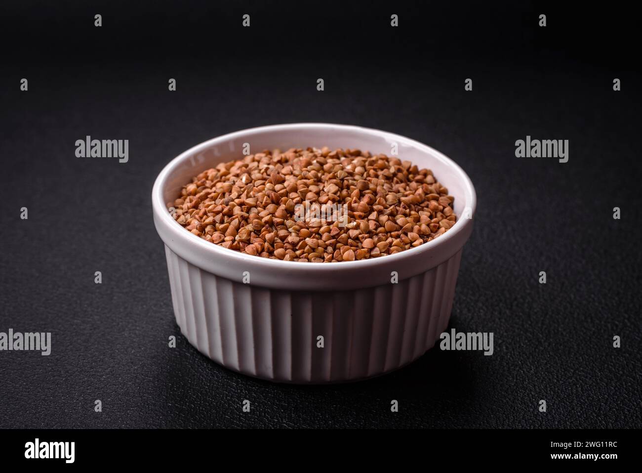 Large grains of raw buckwheat porridge are brown in color. Cooking ...