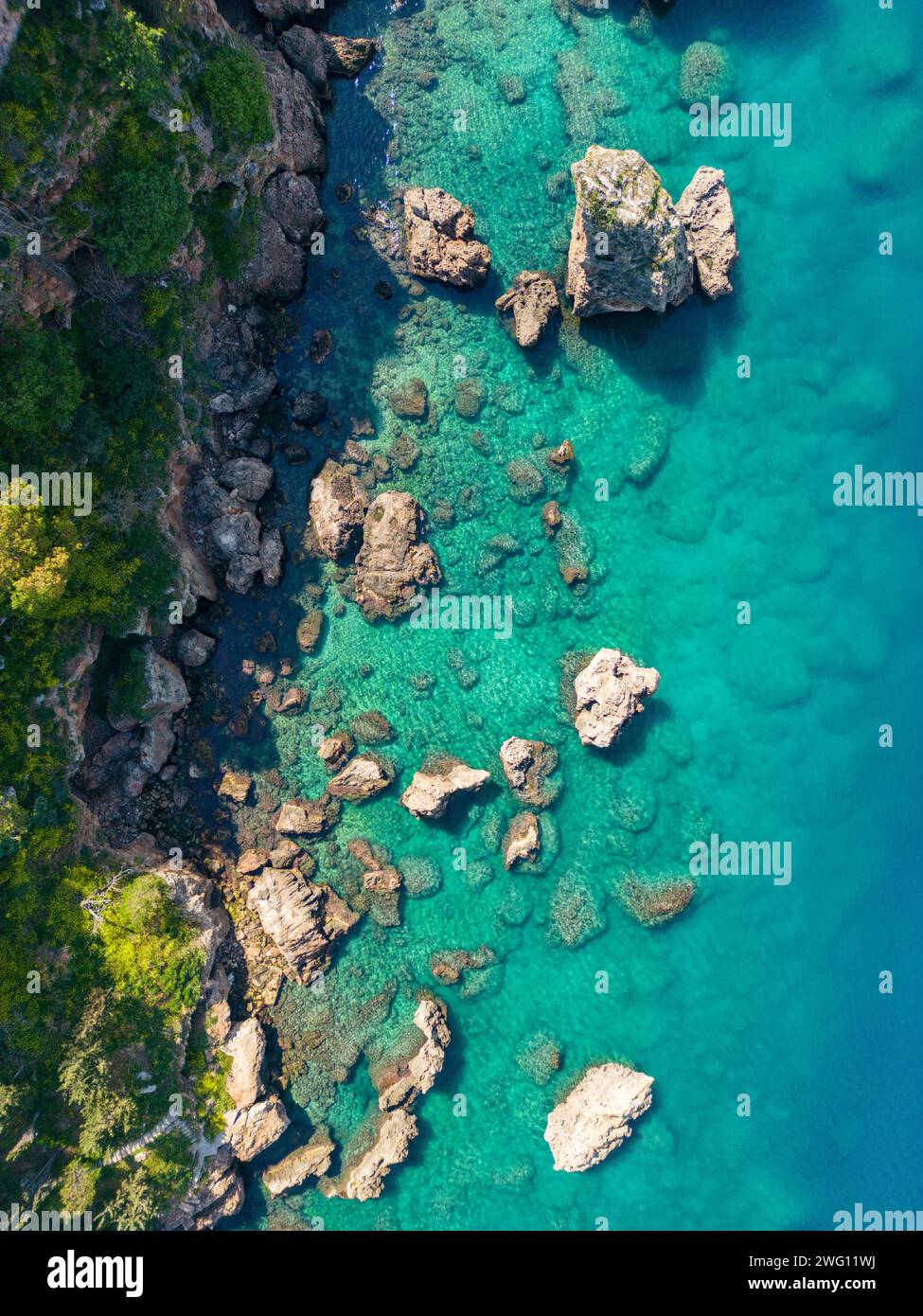 A bird's-eye view from top to bottom of the seashore. Clear azure water ...