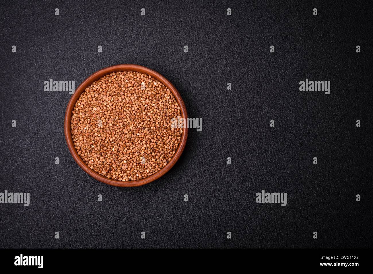 Large grains of raw buckwheat porridge are brown in color. Cooking ...