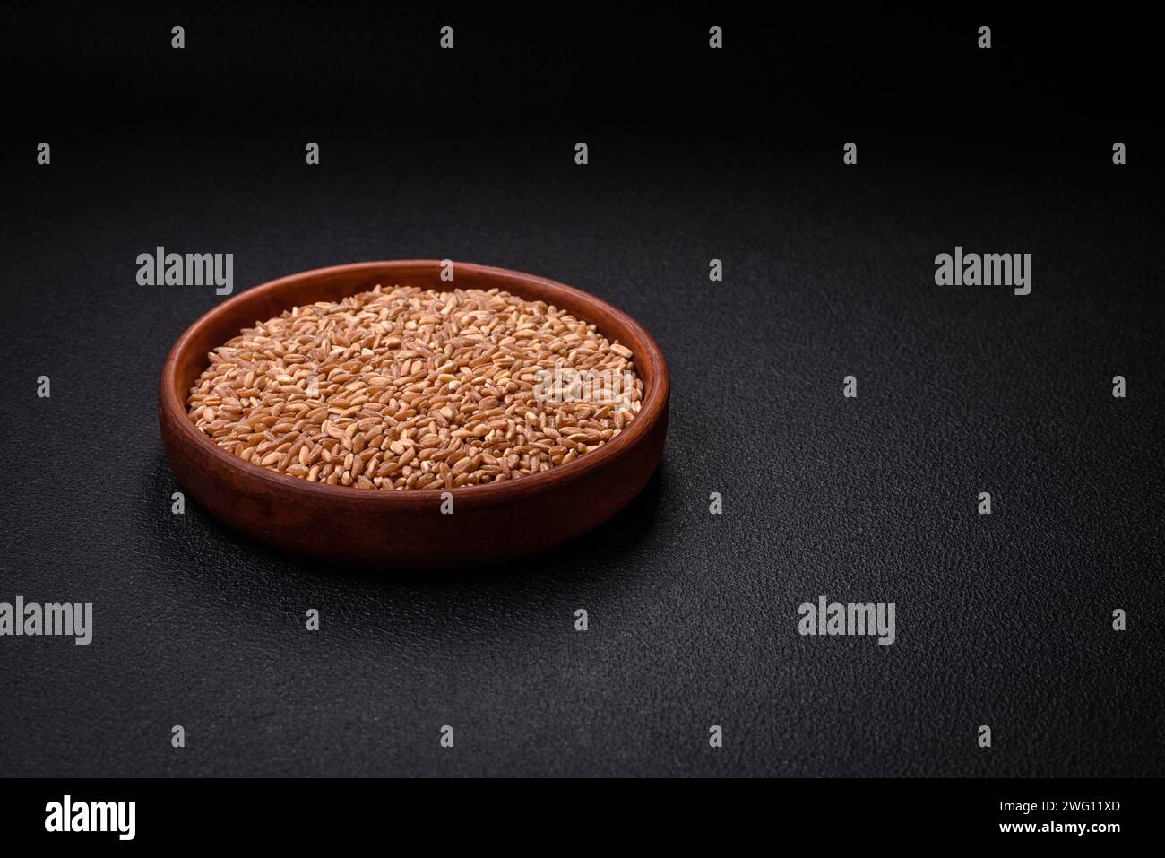 Large grains of wheat porridge are brown in color when raw. Cooking ...