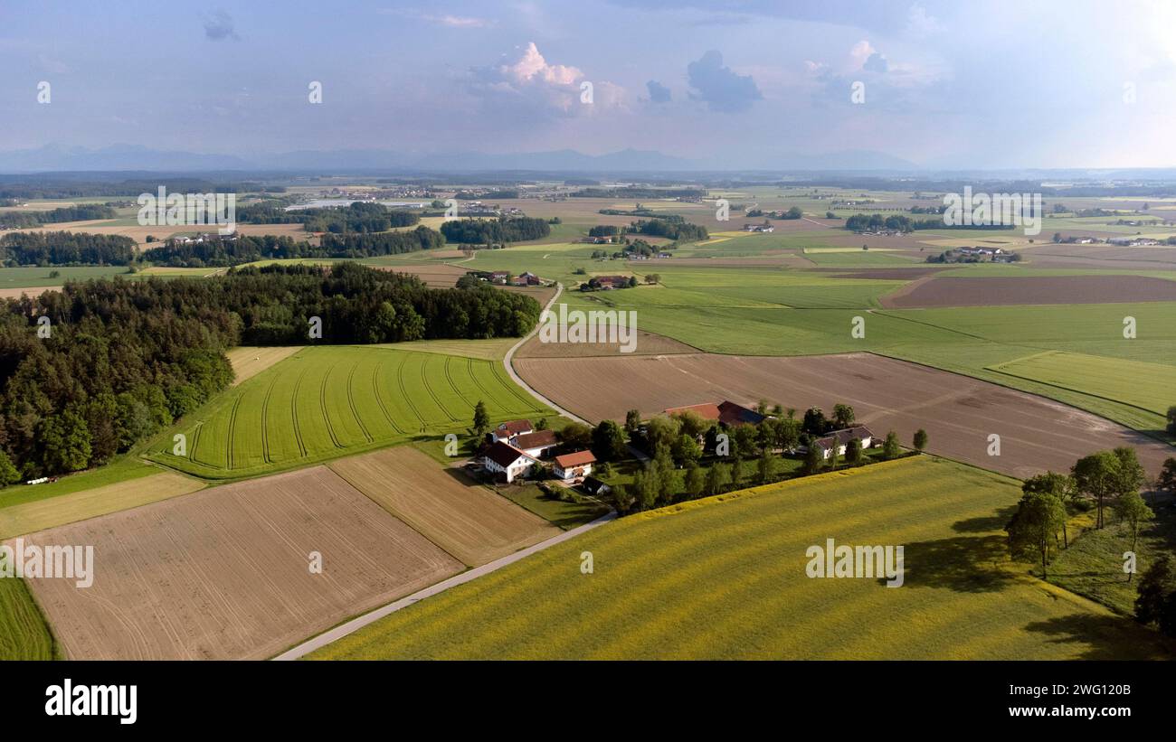 Rural landscape with scattered farms in the foothills of the Alps in ...