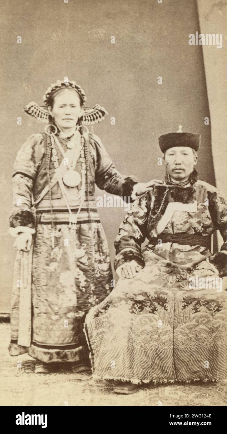 Full-length portrait of wealthy Buriat man and his wife, facing front ...