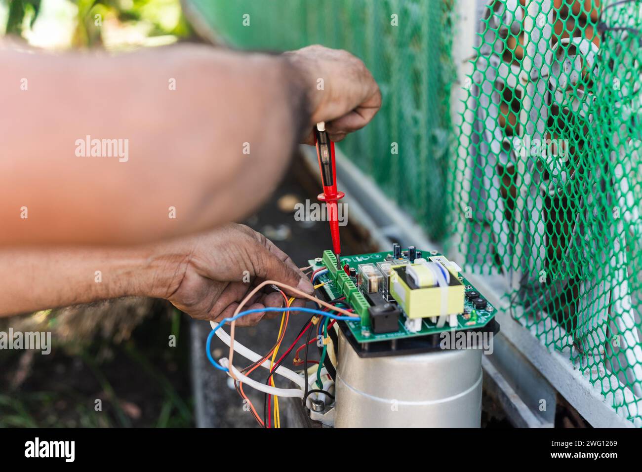 Electricians hand testing switches in electric mainboard Stock Photo ...