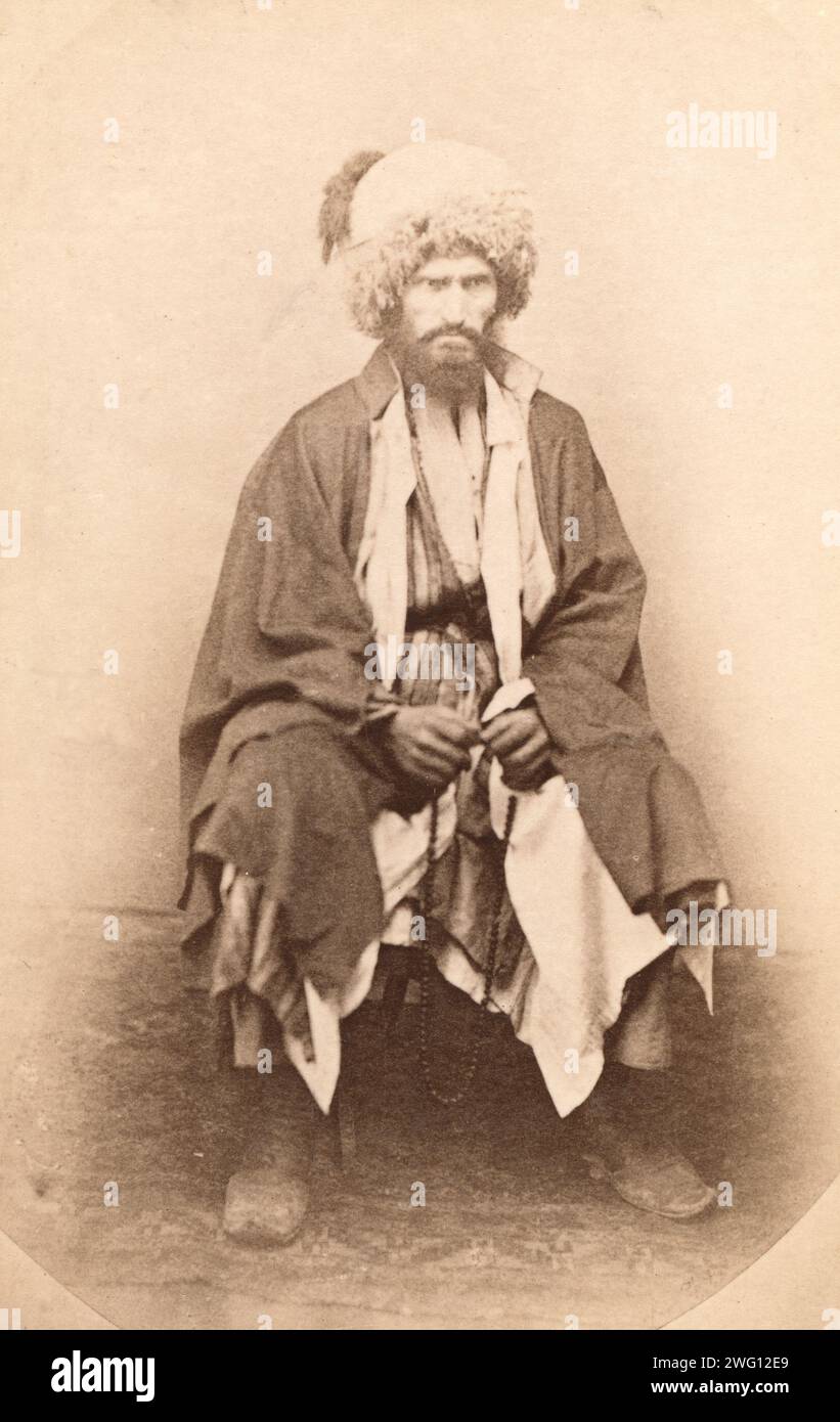 Full-length portrait of man, seated, facing front, between 1870 and ...