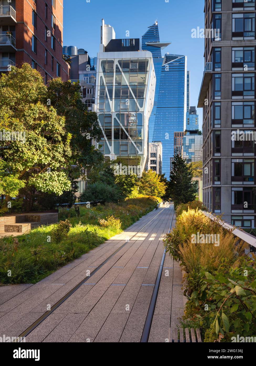 The High Line promenade with Hudson Yards skyscrapers in morning light ...