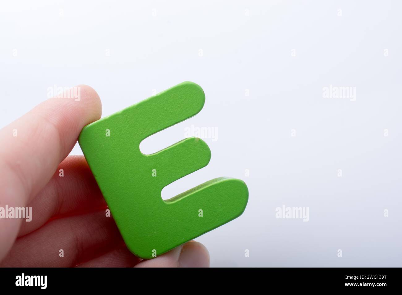 Letter cube of E of Alphabet made of wood Stock Photo - Alamy