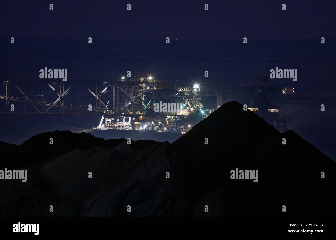 Lignite excavators extract coal in the Welzow open-cast mine, operated ...
