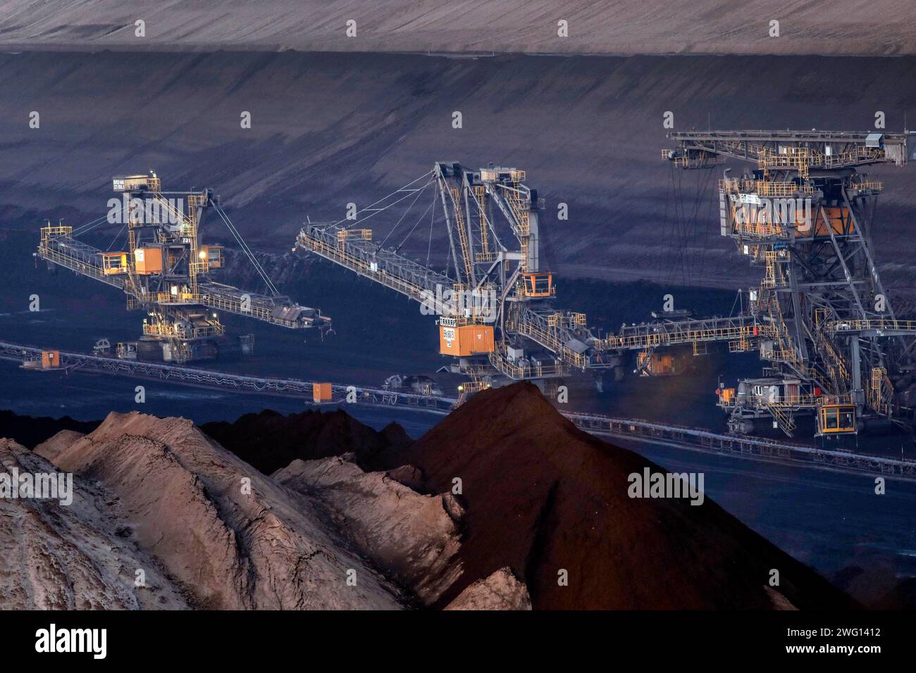 Lignite excavators extract coal in the Welzow open-cast mine, operated ...