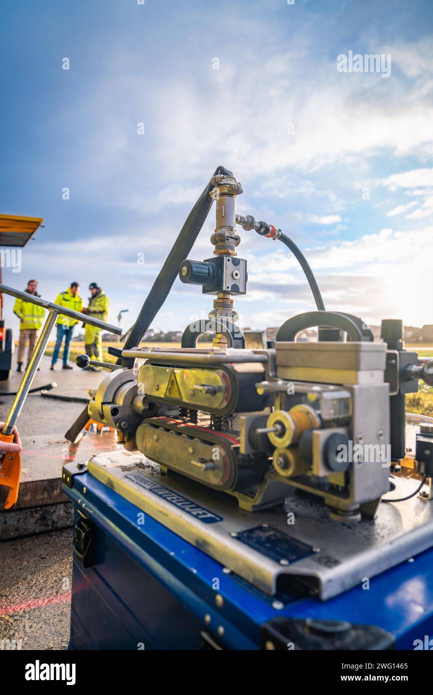 A view of a mobile hydraulic system with skilled workers in the ...