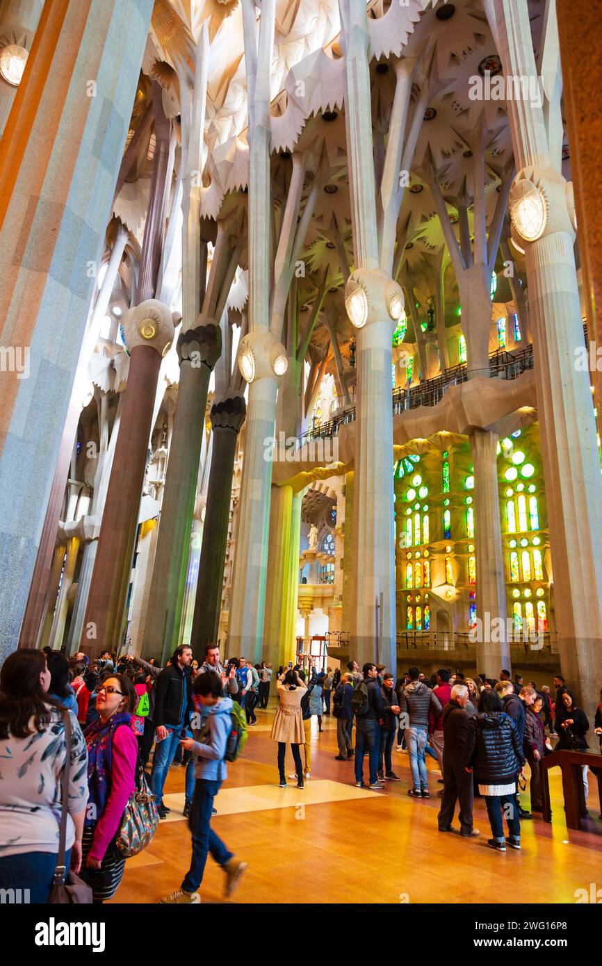 Tourists inside La Sagrada Familia cathedral by Antonio Gaudi ...