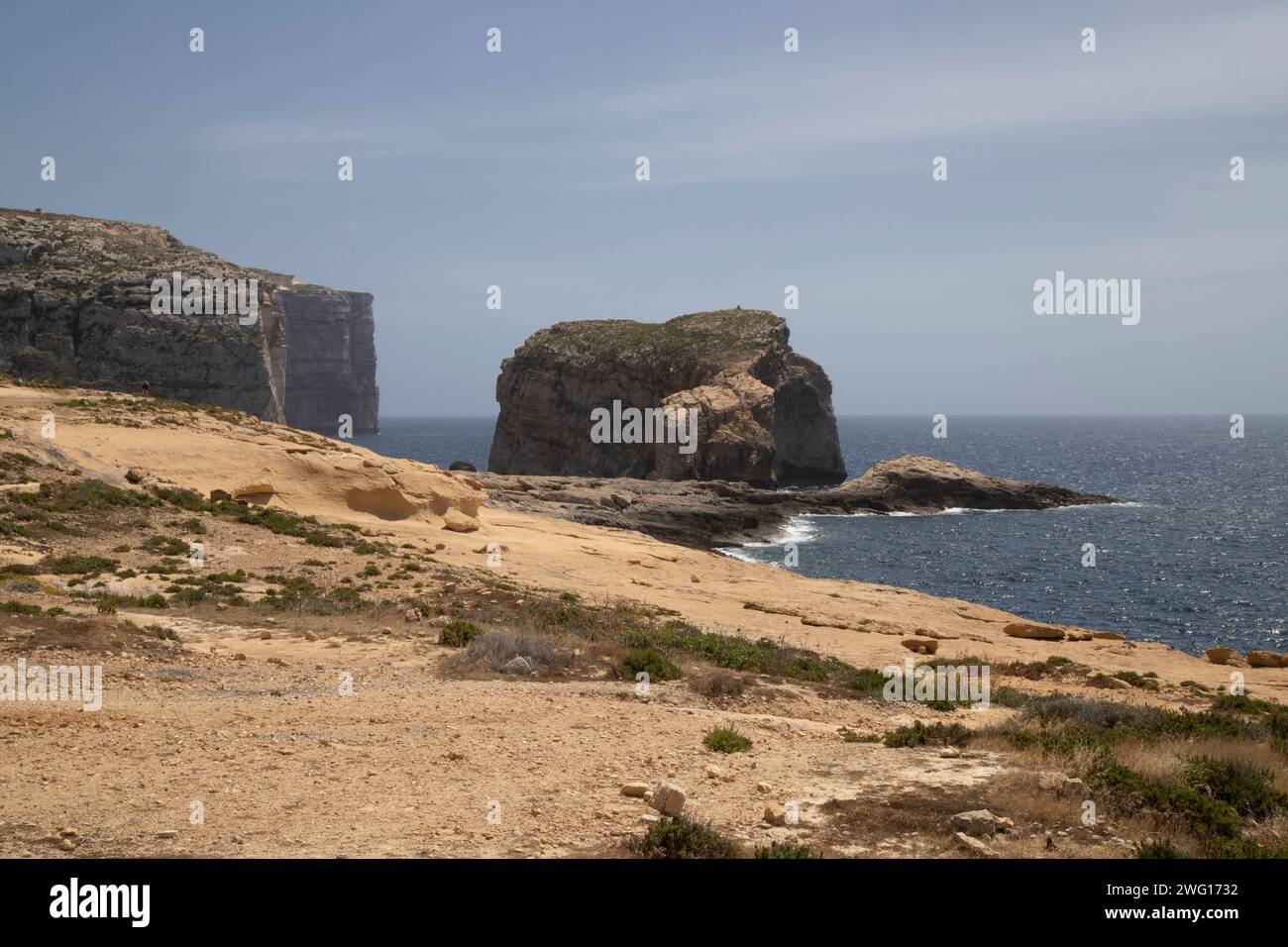 A beautiful shot of stunning rocky landscape surrounding Dwejra Bay ...