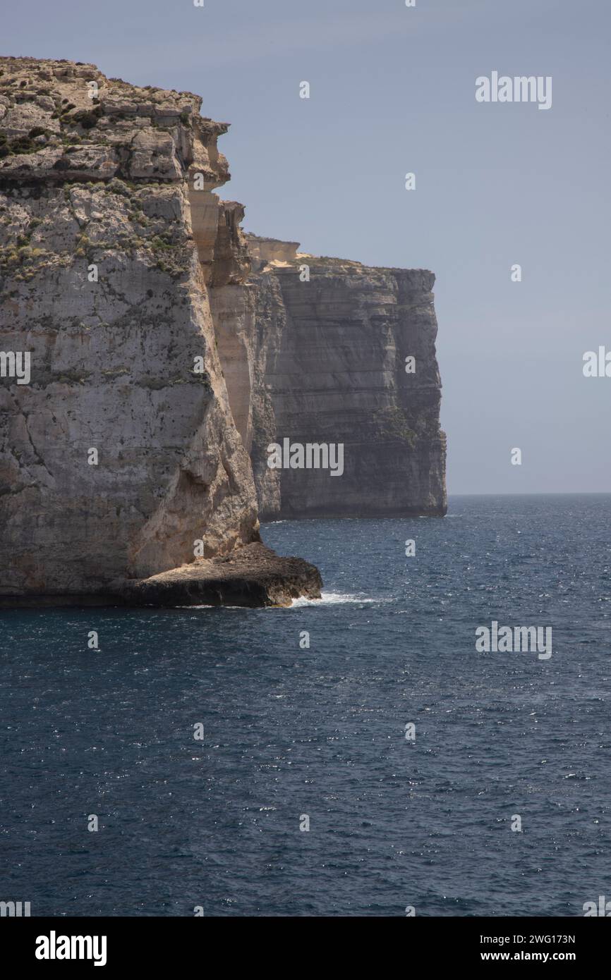 A beautiful shot of stunning rocky landscape surrounding Dwejra Bay ...
