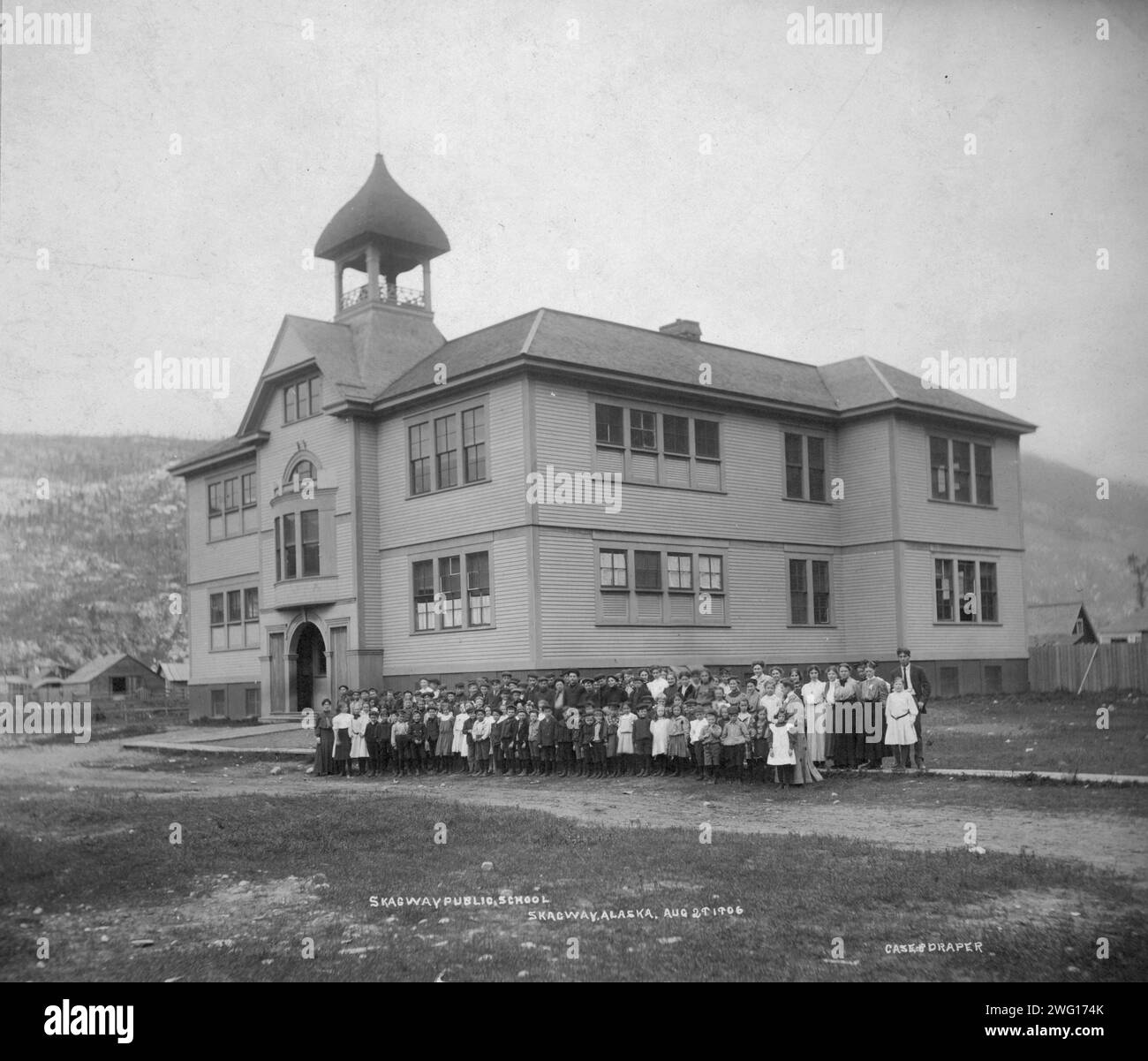 Public school, 1906. Group portrait of students and teachers in front ...