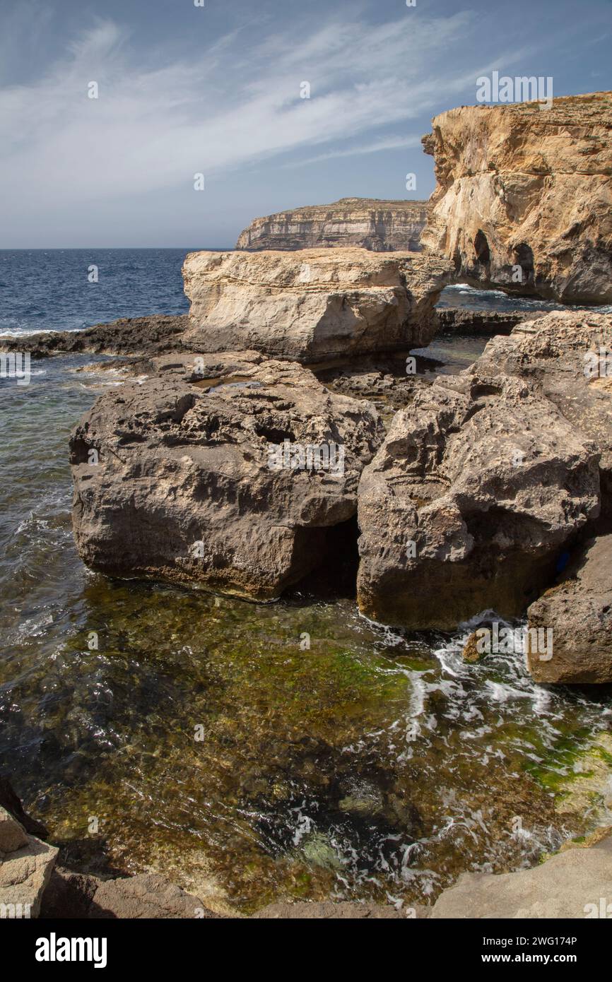 A beautiful shot of stunning rocky landscape surrounding Dwejra Bay ...