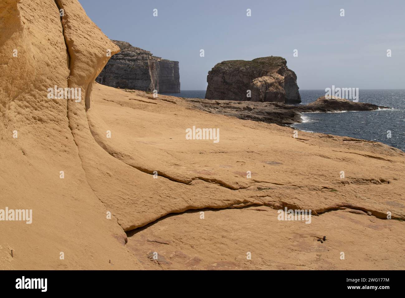 A beautiful shot of stunning rocky landscape surrounding Dwejra Bay ...