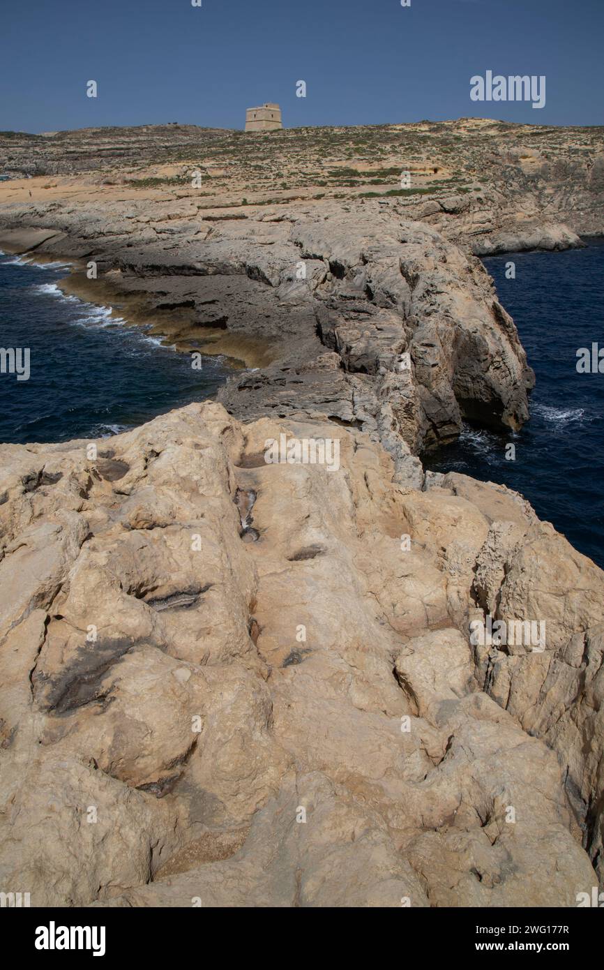 A beautiful shot of stunning rocky landscape surrounding Dwejra Bay ...