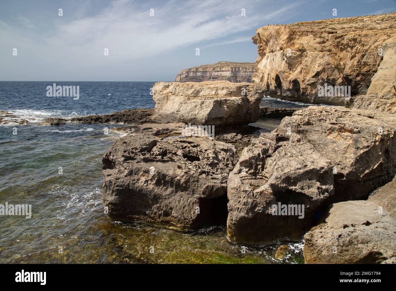 A beautiful shot of stunning rocky landscape surrounding Dwejra Bay ...