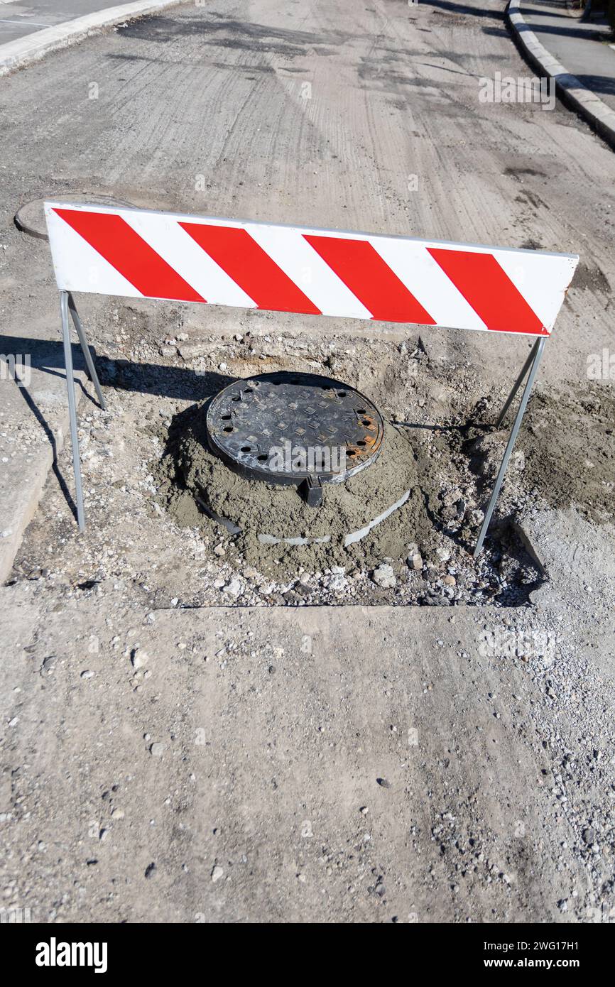 reparation and installation of road manhole Stock Photo - Alamy