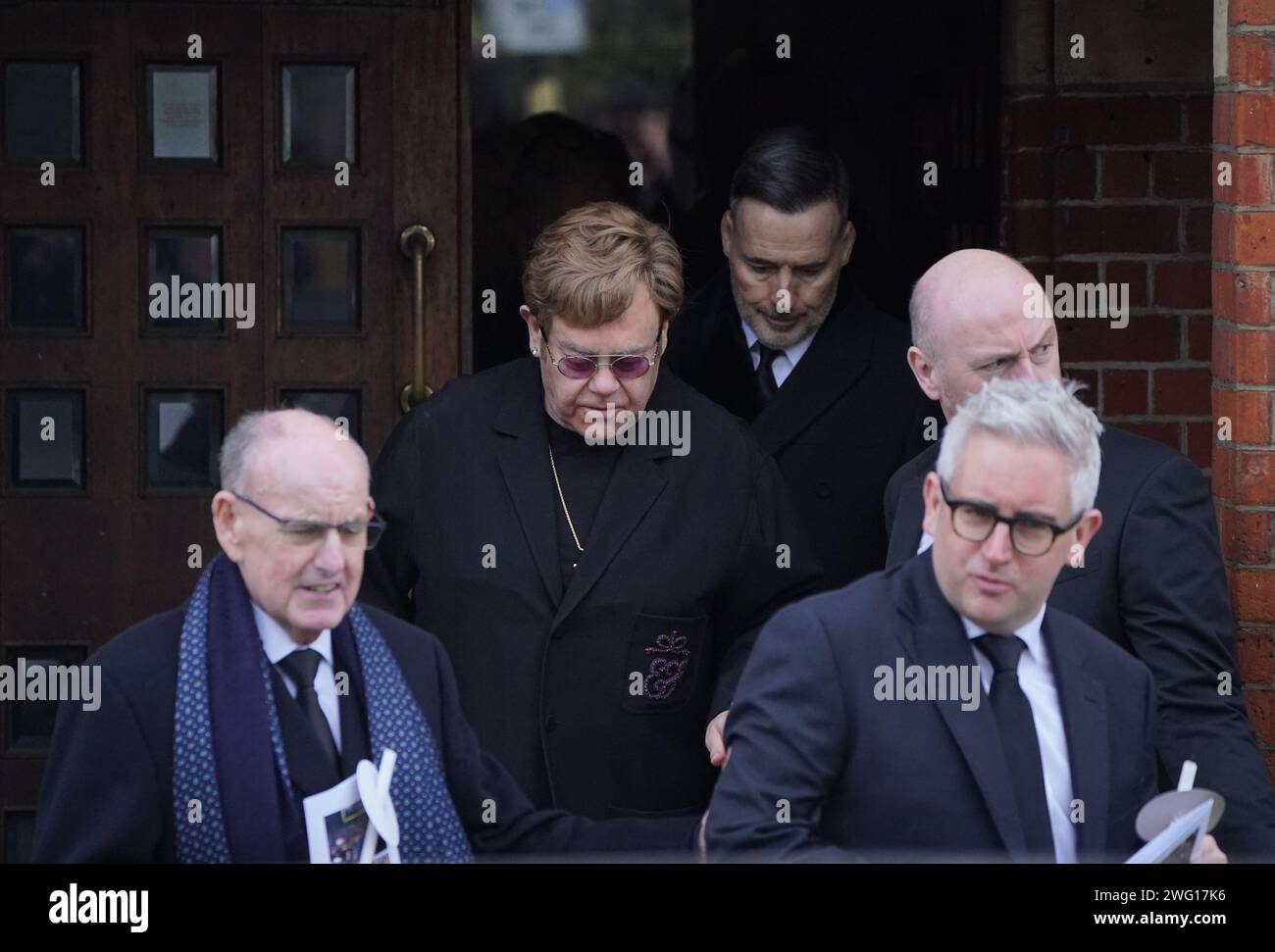 Sir Elton John and David Furnish leaving the funeral service of Derek ...