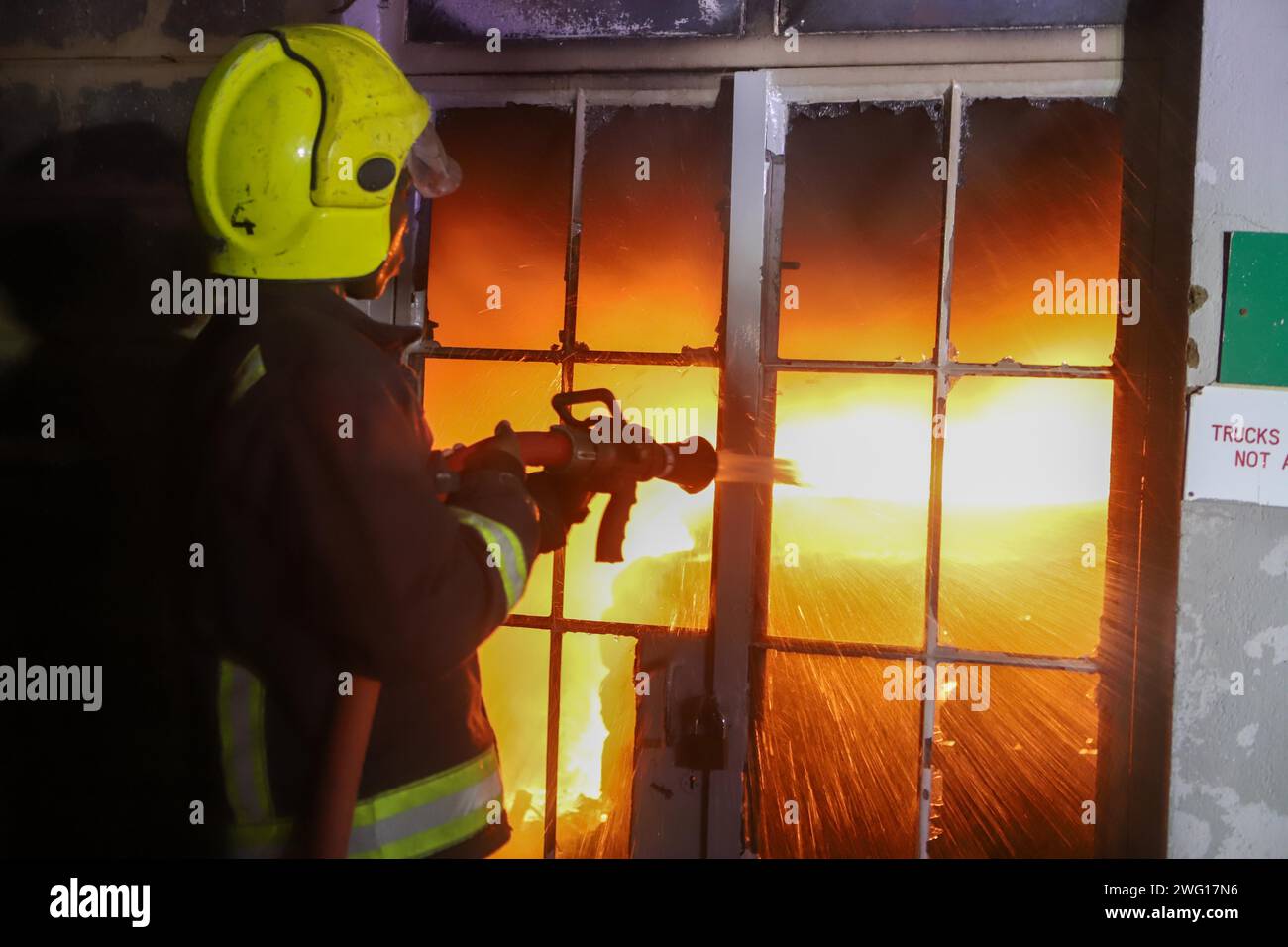 (240202) -- NAIROBI, Feb. 2, 2024 (Xinhua) -- A firefighter works at ...