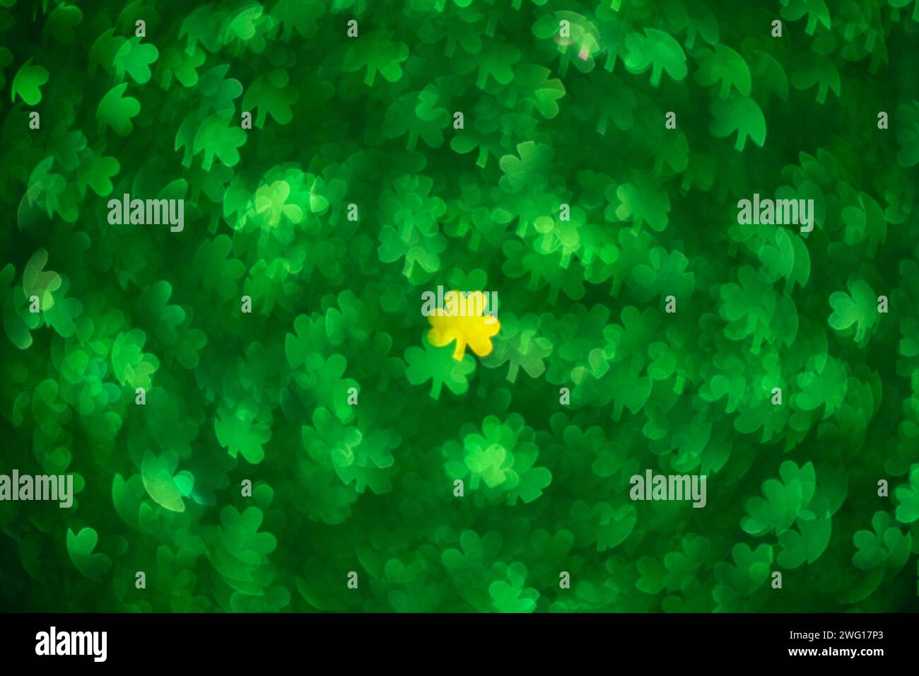 Abstract green background with clover leaves highlights. Spring, summer ...