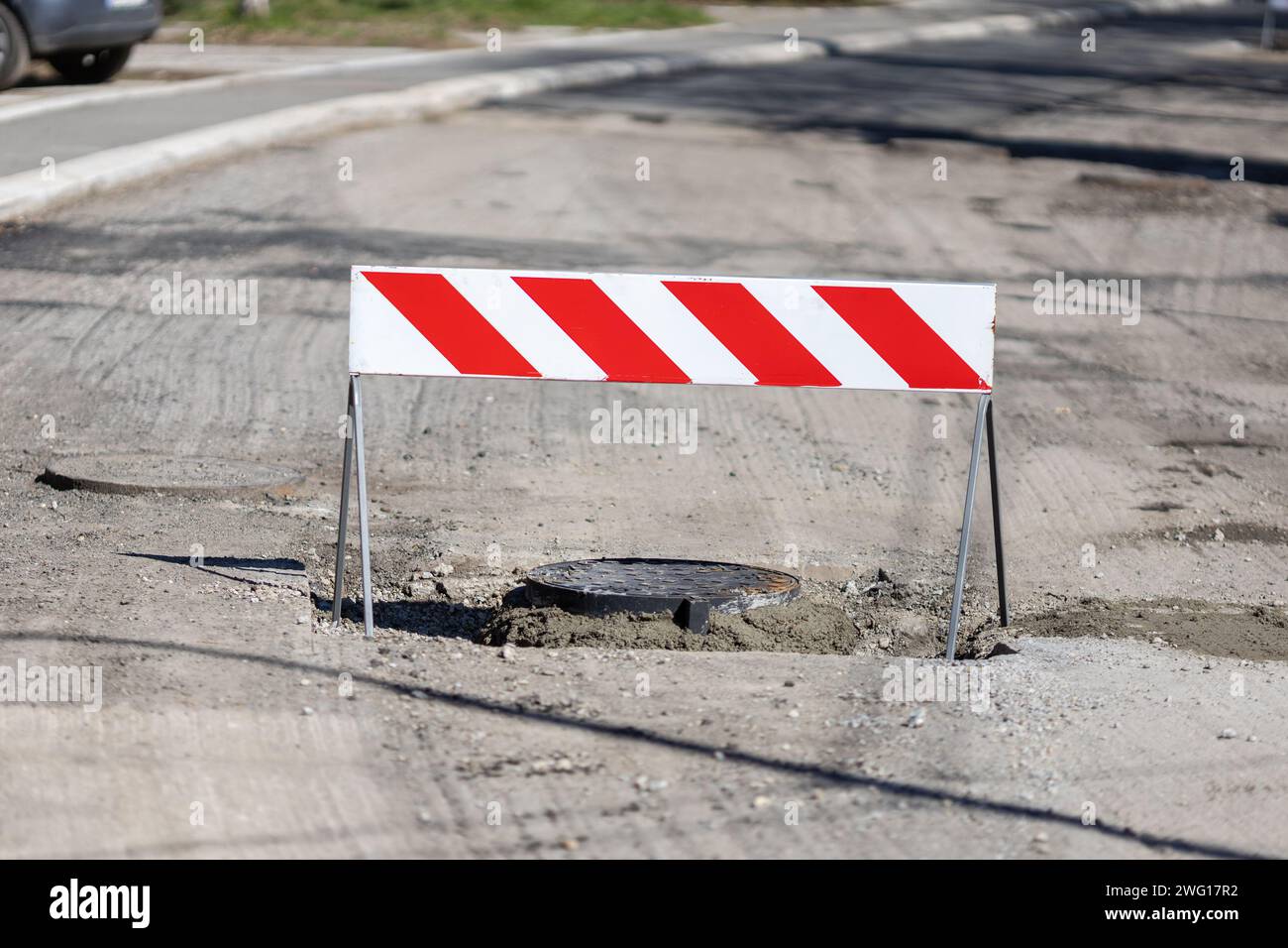 road reparation and manhole installation Stock Photo - Alamy