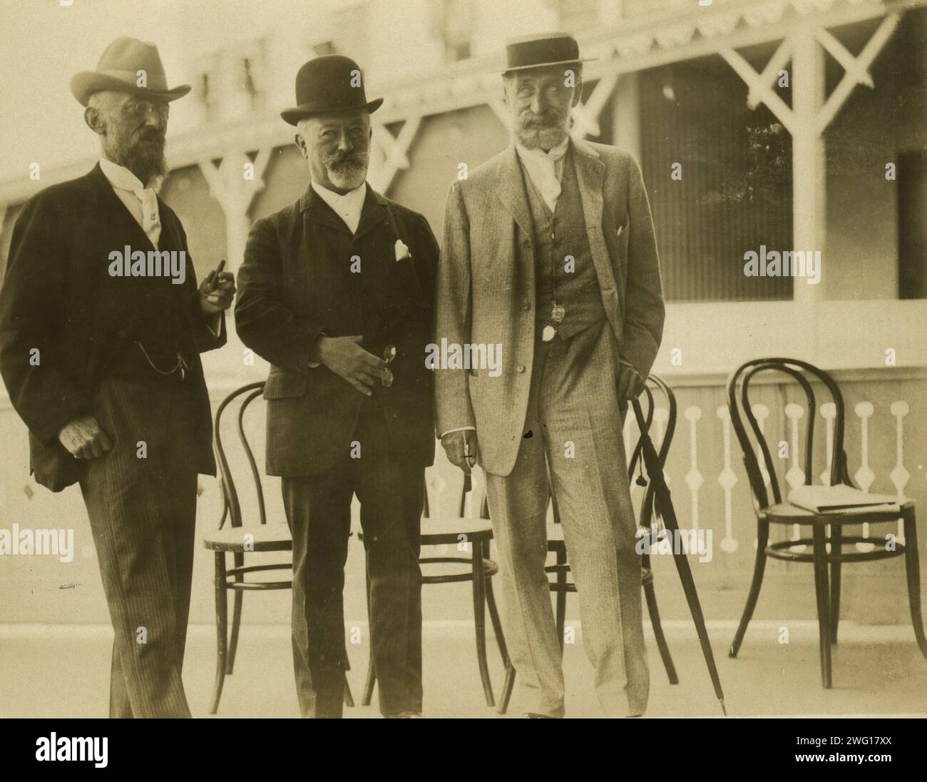 Three men, probably journalists, full-length portrait, facing front ...