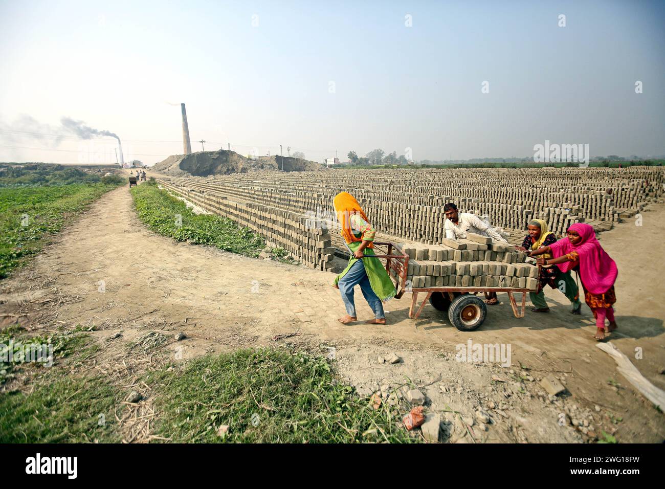Laborers work at a brickyard on February 02, 2024, in Dhaka, Bangladesh ...