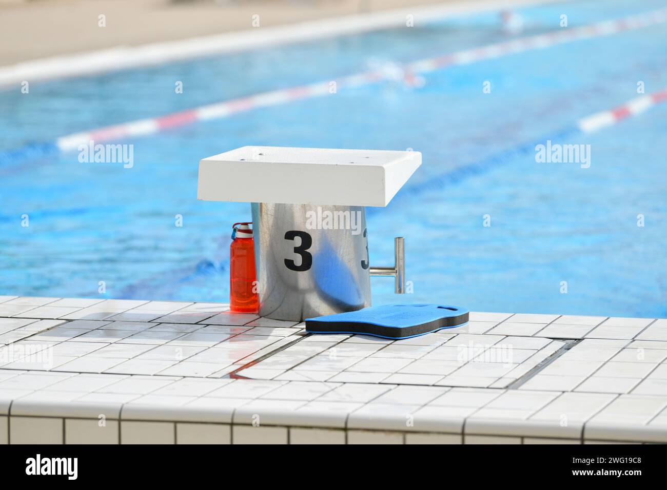 The starting blocks ready to dive into the pool Stock Photo - Alamy