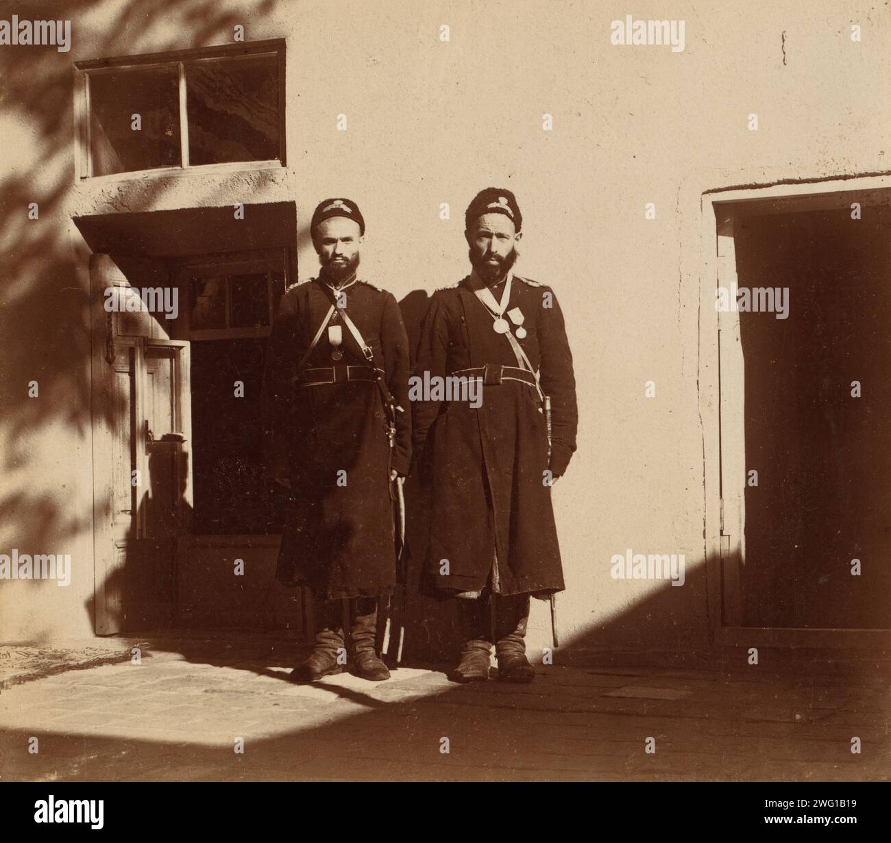 Native police, Samarkand, between 1905 and 1915. Two policemen standing outside Stock Photo - Alamy