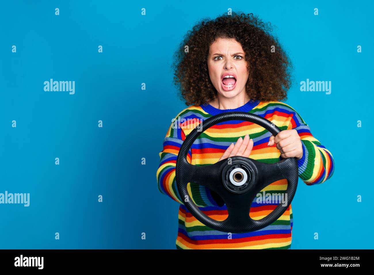 Photo portrait of pretty young girl beep horn steering wheel traffic ...