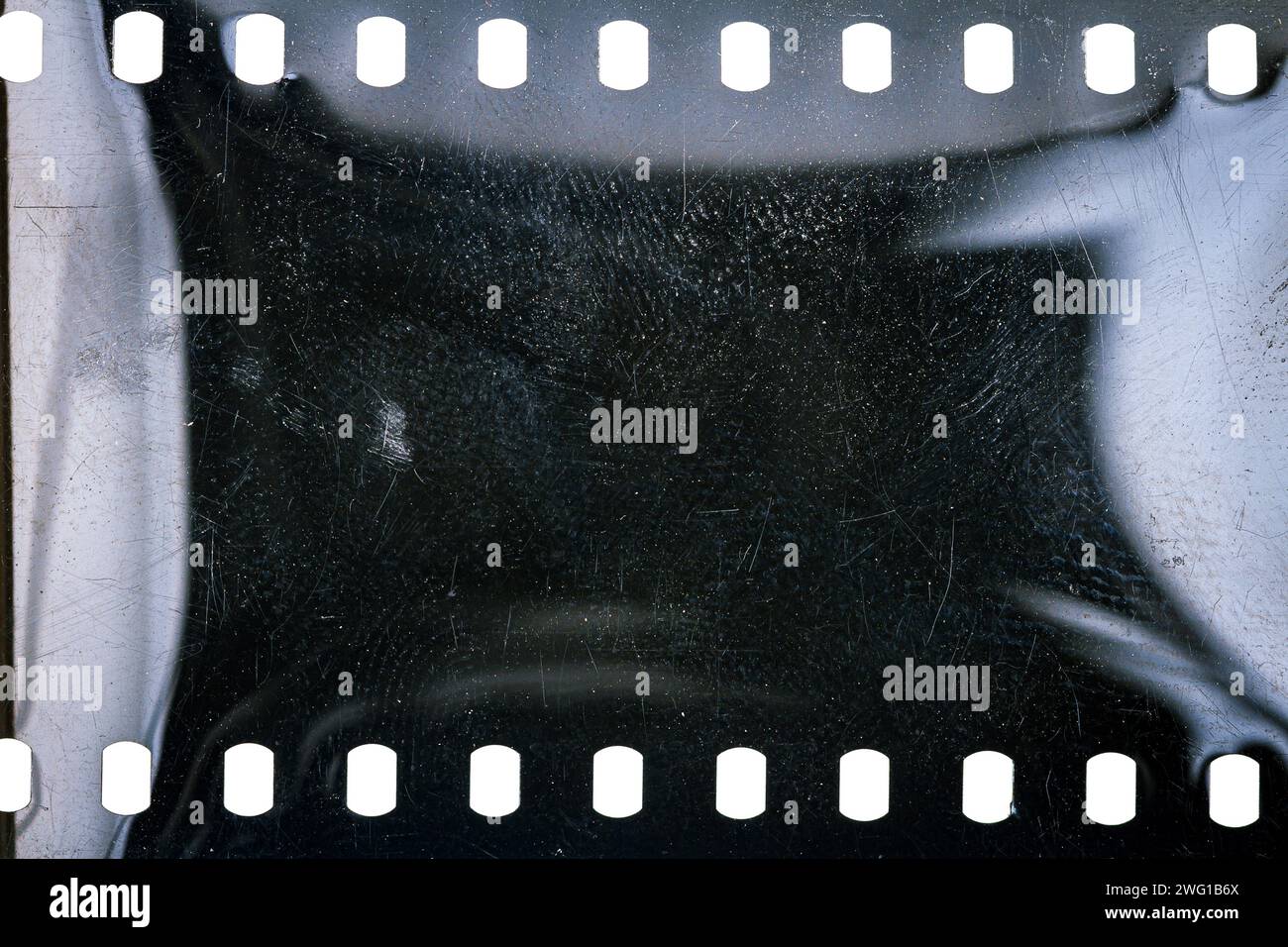 Dusty and grungy 35mm film texture or surface. Perforated scratched ...