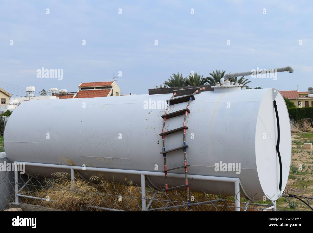A very large metal water tank based in a field in Limassol,Cyprus.It is ...