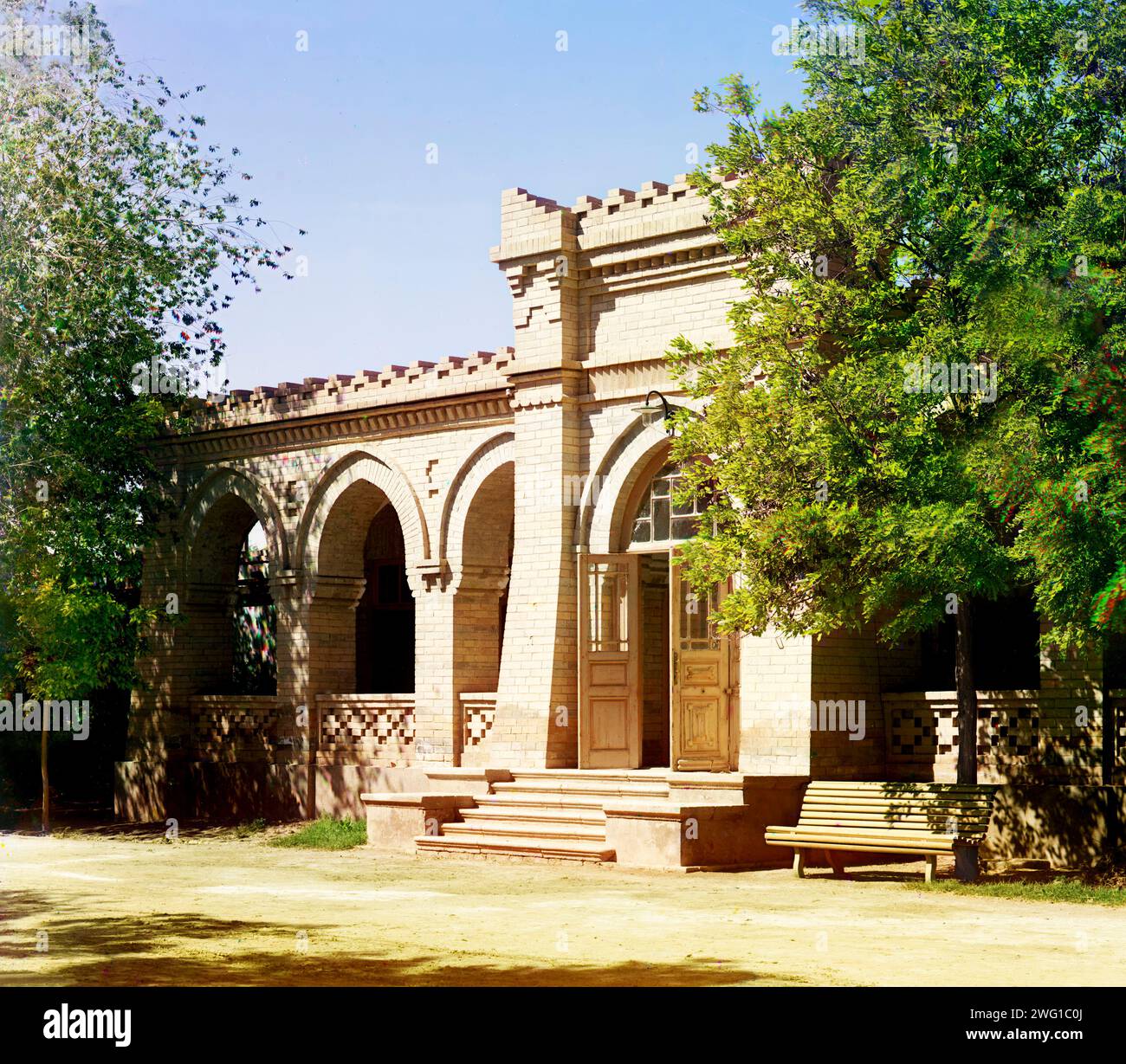 Brick building with arched entrance and arcade, [Russia/Central Asia ...